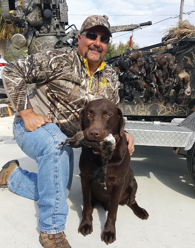Guide Lewis Clanton with his dog Grizz. Photography courtesy of Lewis ...