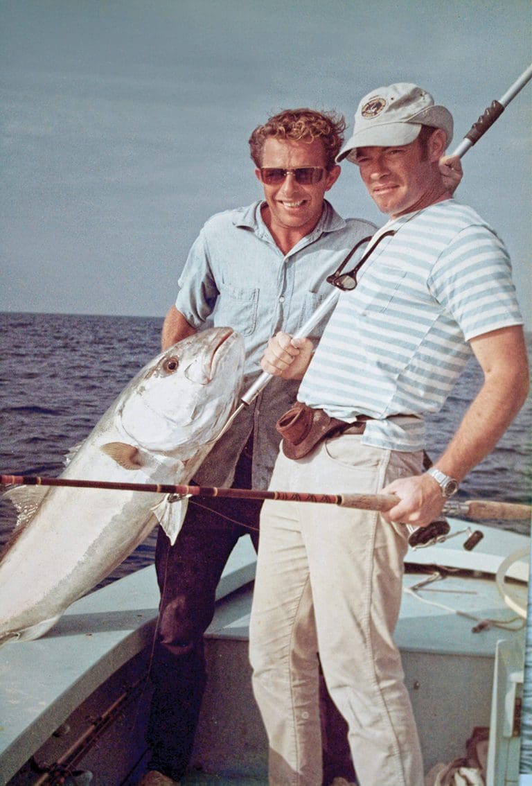 Pallot and Norman Duncan slide an amberjack over the gunwale in 1968 ...
