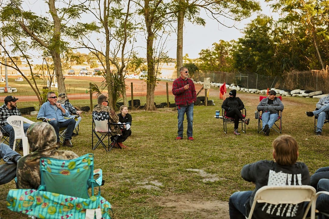 Wes Pyburn, known among the club as the Red Rocket, leads the pre-race ...